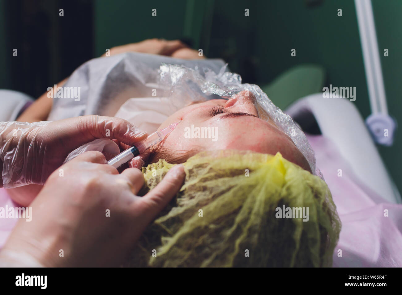 Beautician making injection in woman's face, closeup. Biorevitalization ...