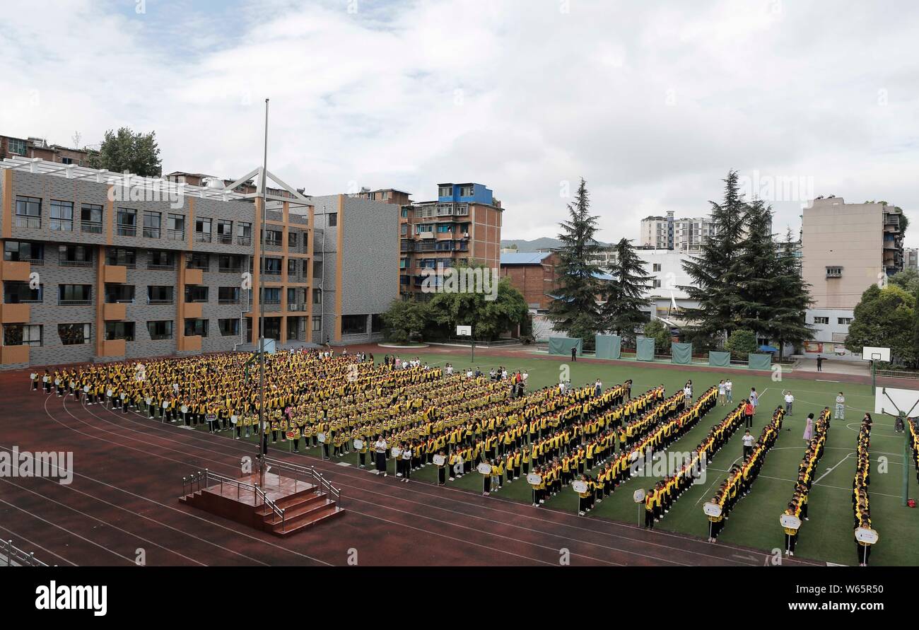 Primary school students attend flag raising hi-res stock photography ...