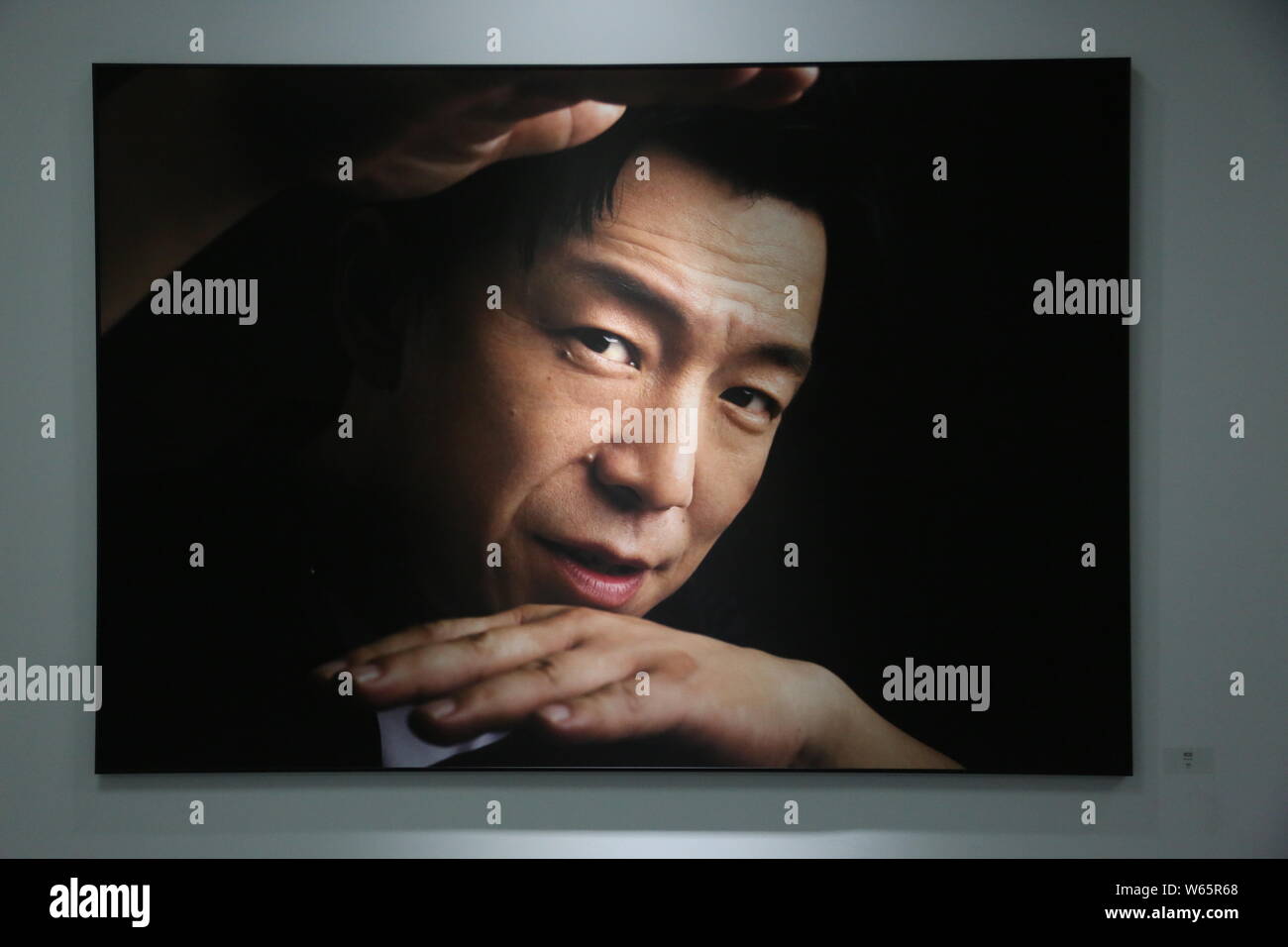 A portrait of Chinese actor Huang Bo is on display during the solo ...