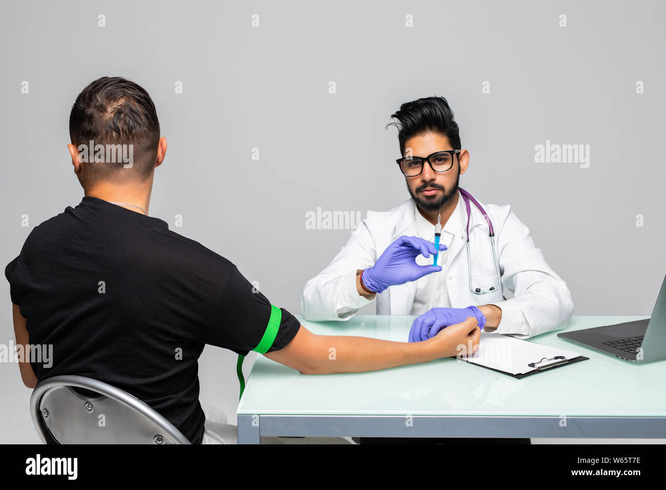 Indian doctor injection hi-res stock photography and images - Alamy