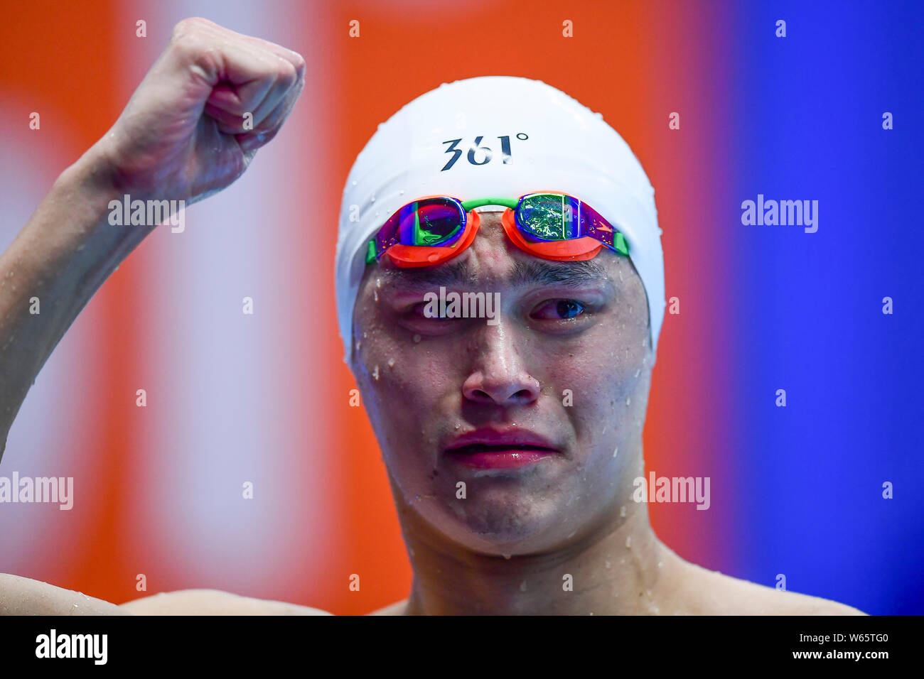 Sun Yang of China sweeps after winning the men's 1500m freestyle final ...