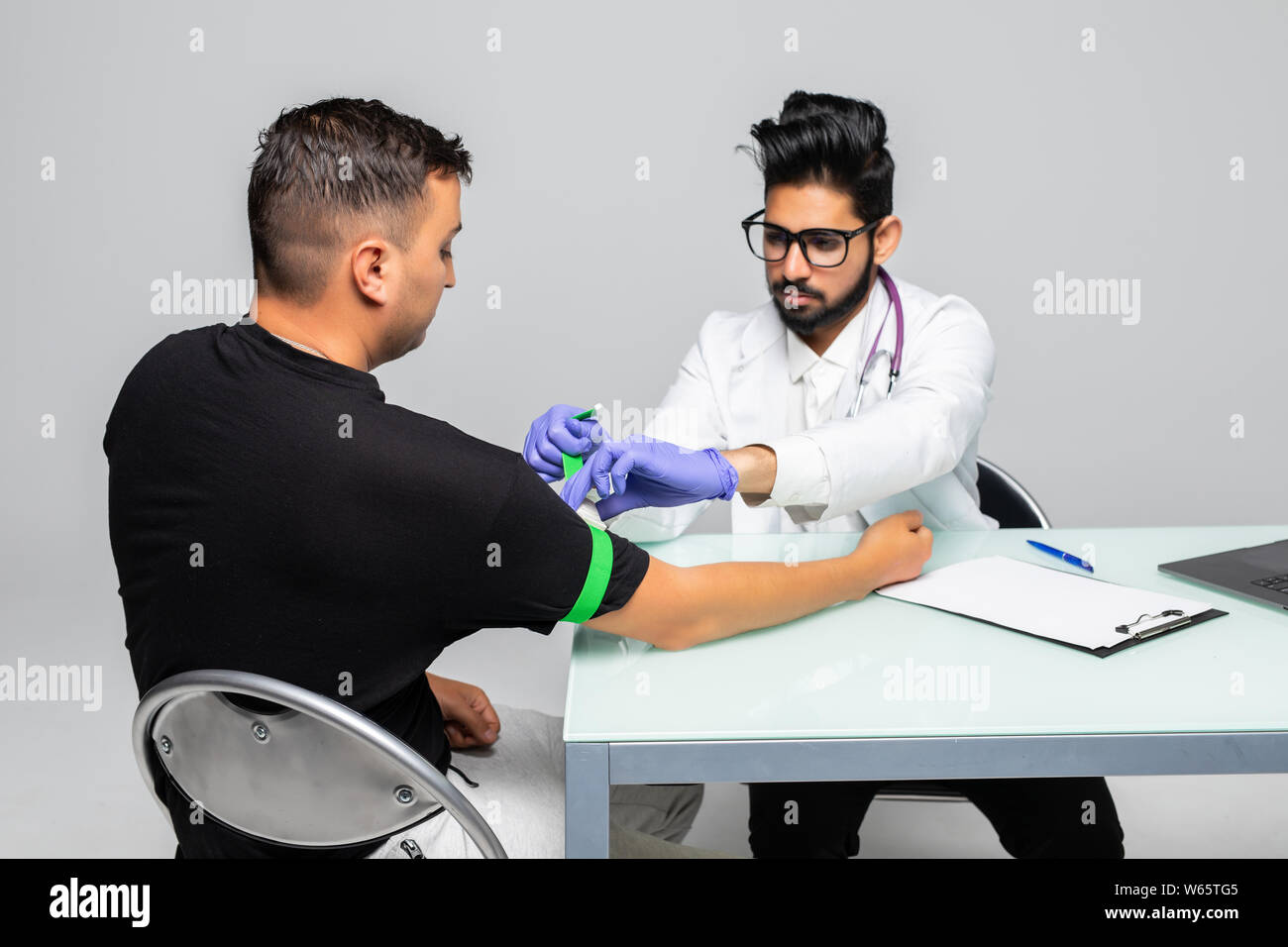 One indian doctor injection hi-res stock photography and images - Alamy