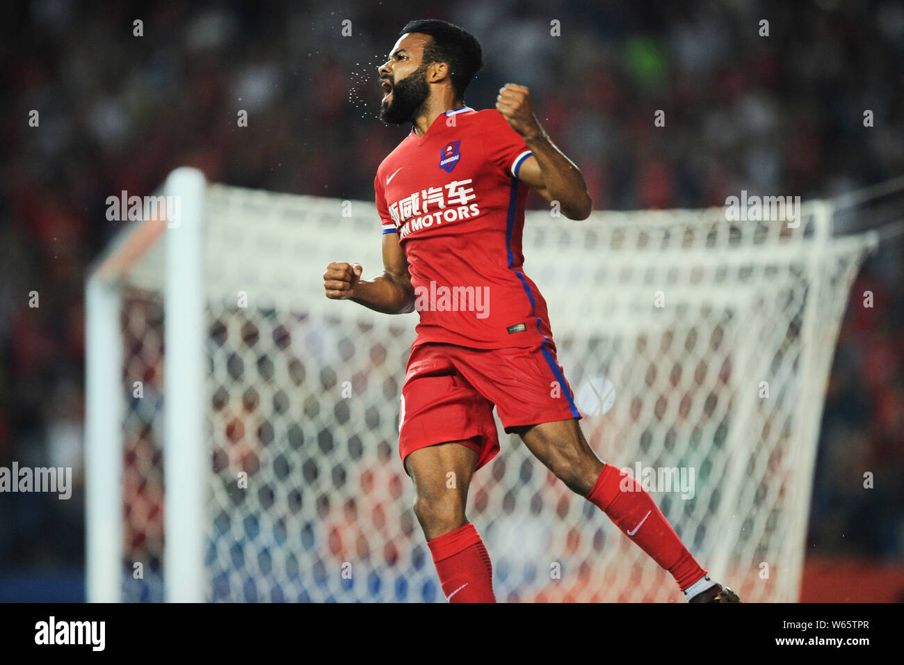 Brazilian football player Luiz Fernandinho of Chongqing SWM celebrates ...
