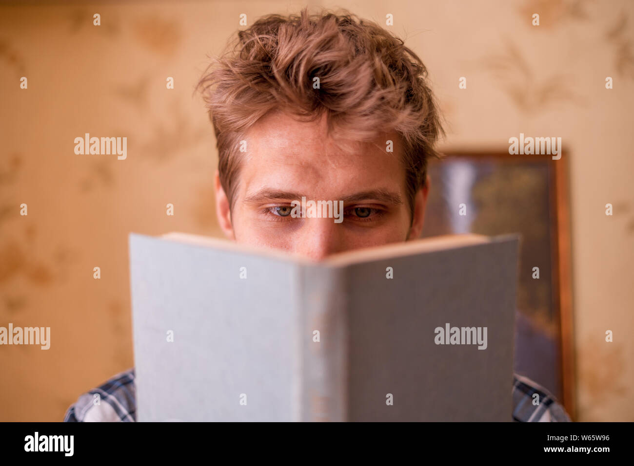 close up view of man's eyes looking in the book, careful reading Stock ...
