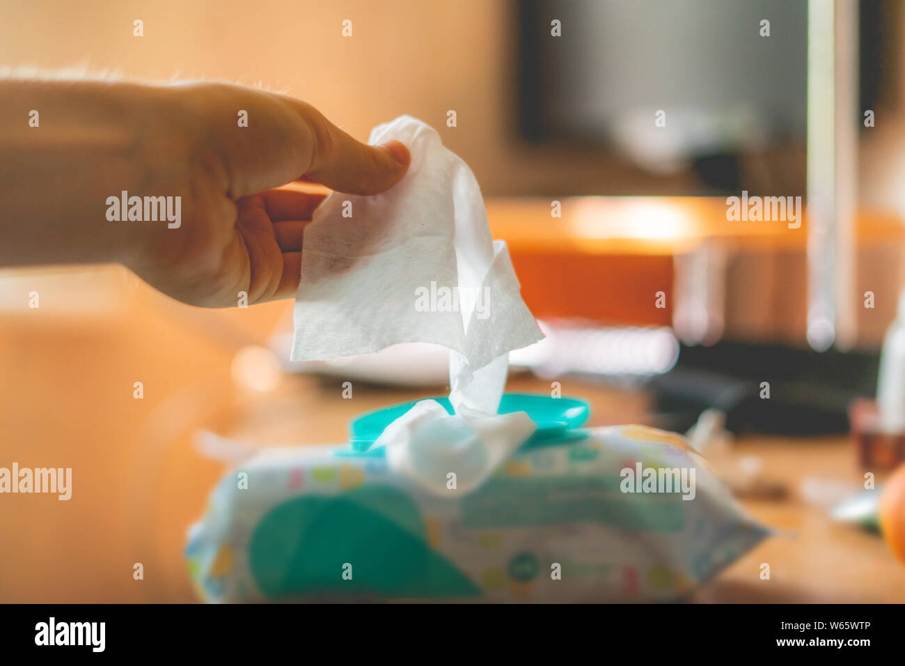 hand taking the wet wipe to clean skin Stock Photo - Alamy