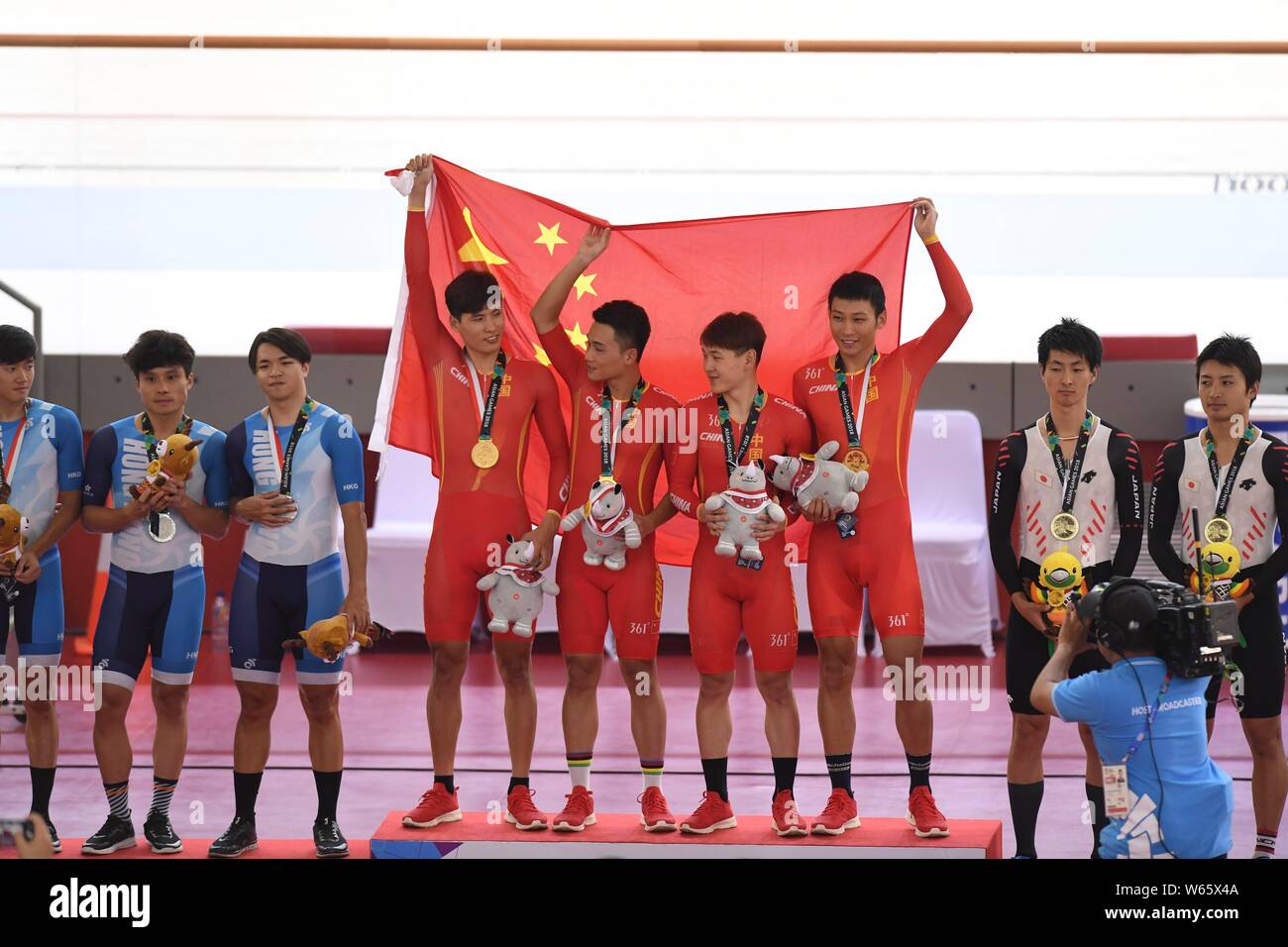 (From left) Silver medalist Team Hong Kong, gold medalist Team China ...