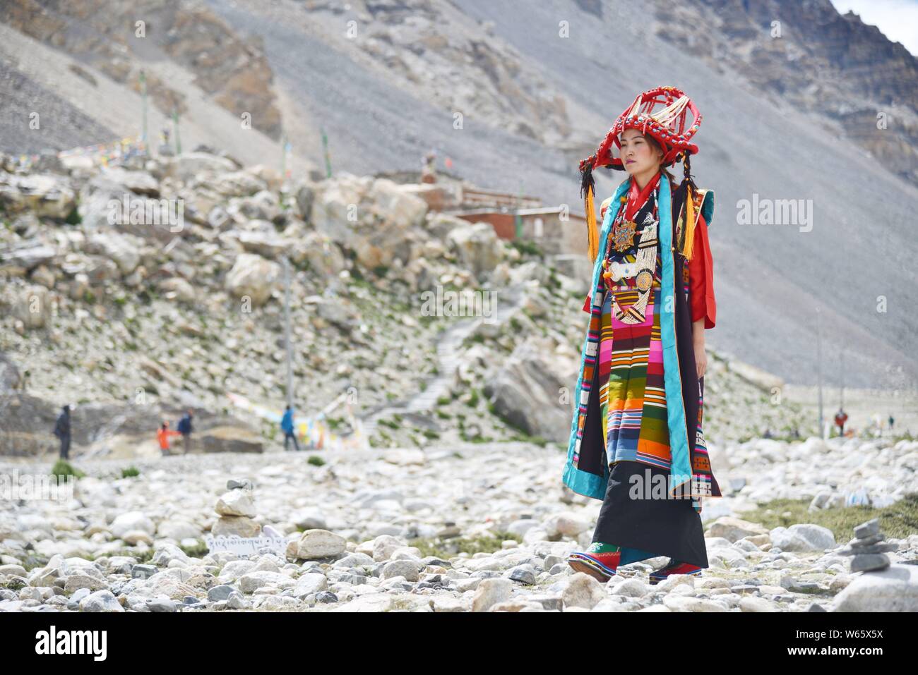 A model presents a new creation of traditional Tibetan costume during a ...