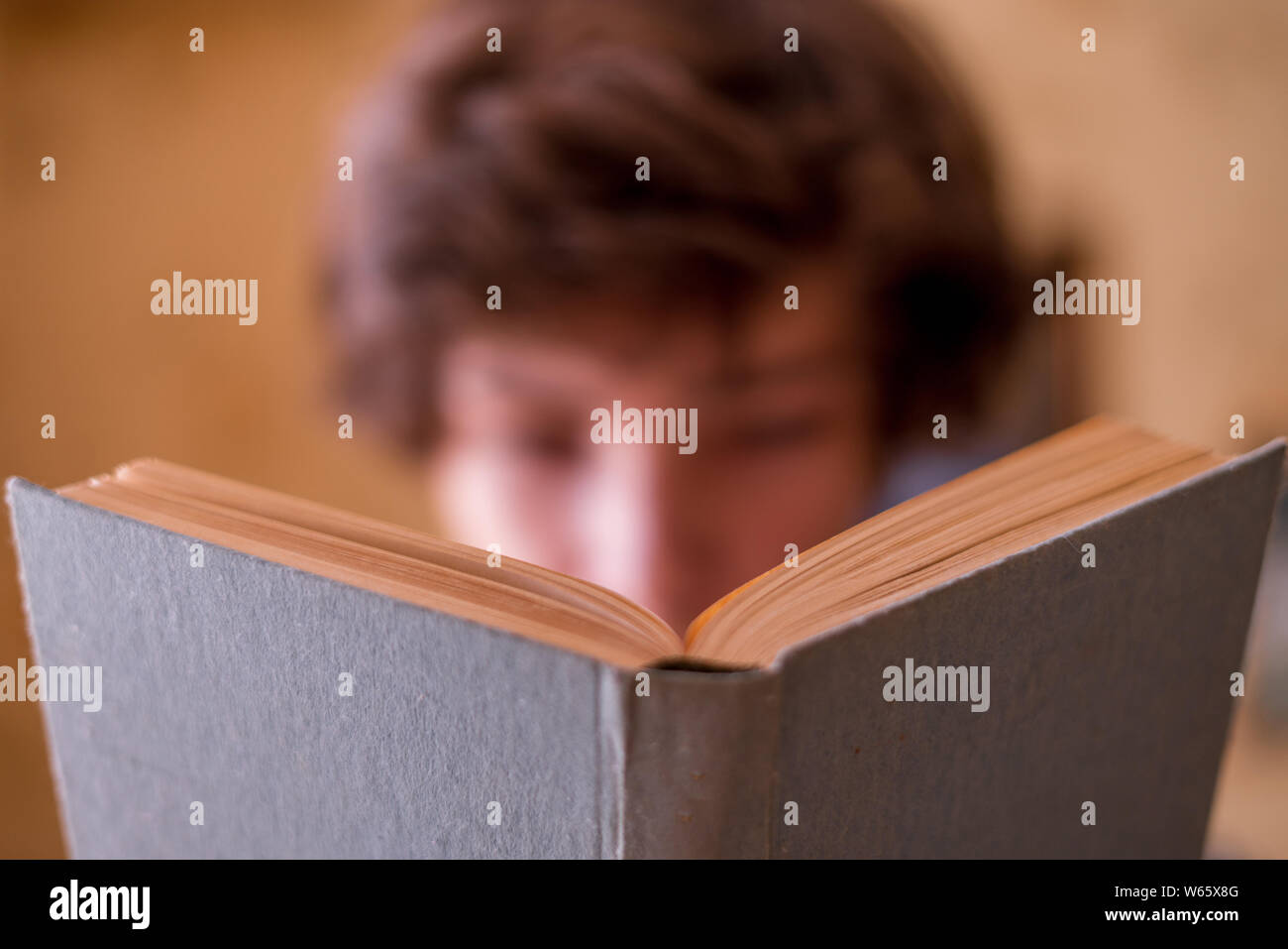 close up view of man's eyes looking in the book, careful reading Stock ...