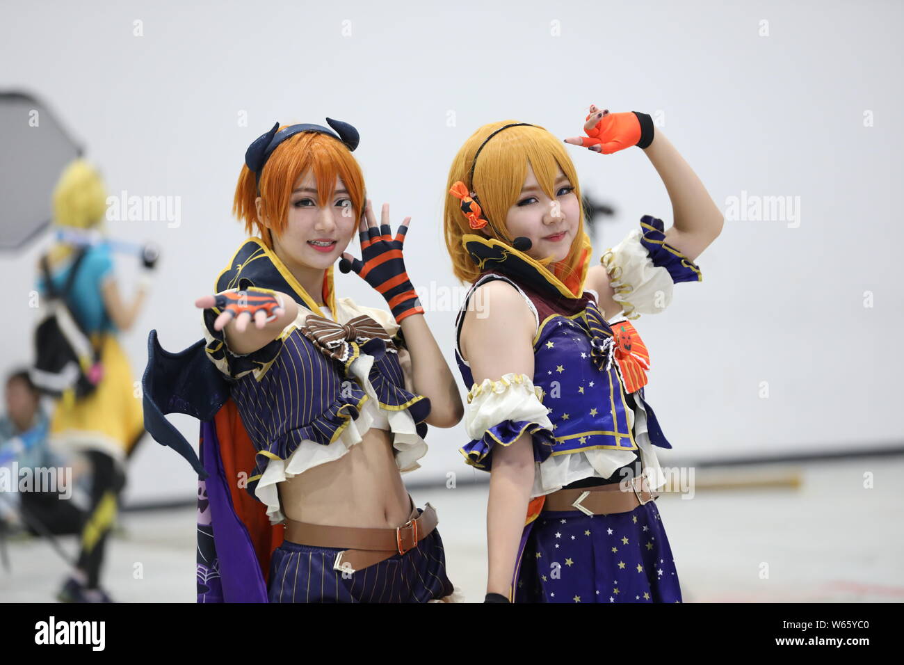 Chinese cosers dressed in cosplay costumes pose during the Beijing ...