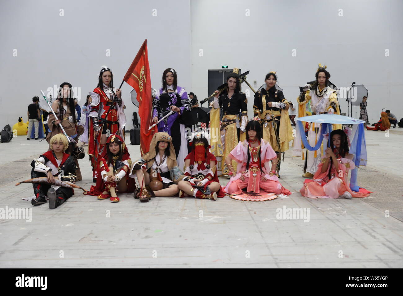 Chinese cosers dressed in cosplay costumes pose during the Beijing ...