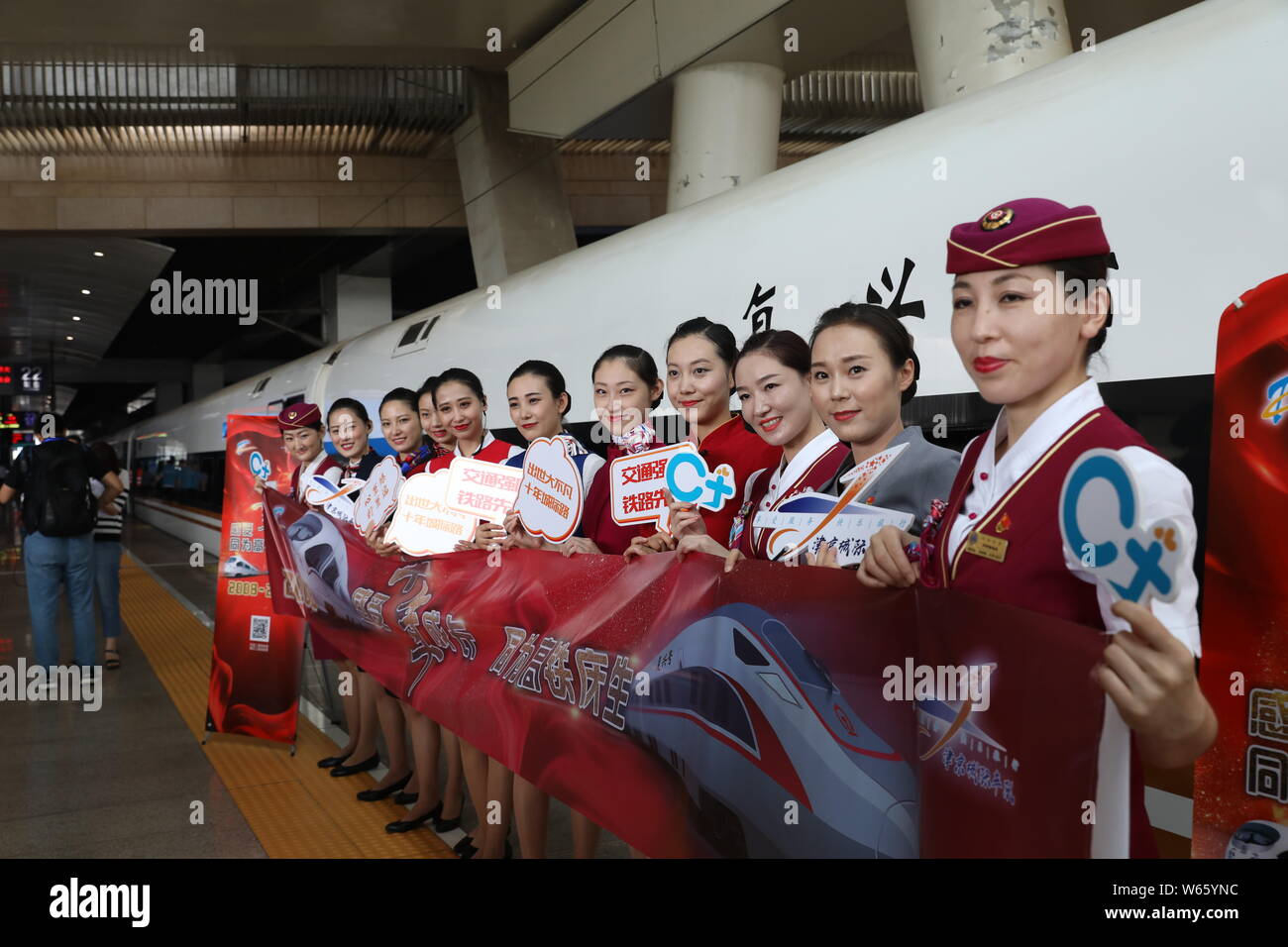 Chinese train attendants, dressed in the nine uniforms over the past ...
