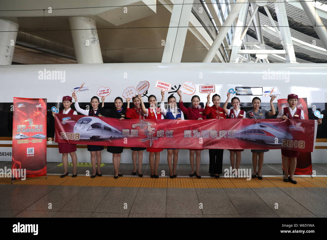 Chinese train attendants, dressed in the nine uniforms over the past ...