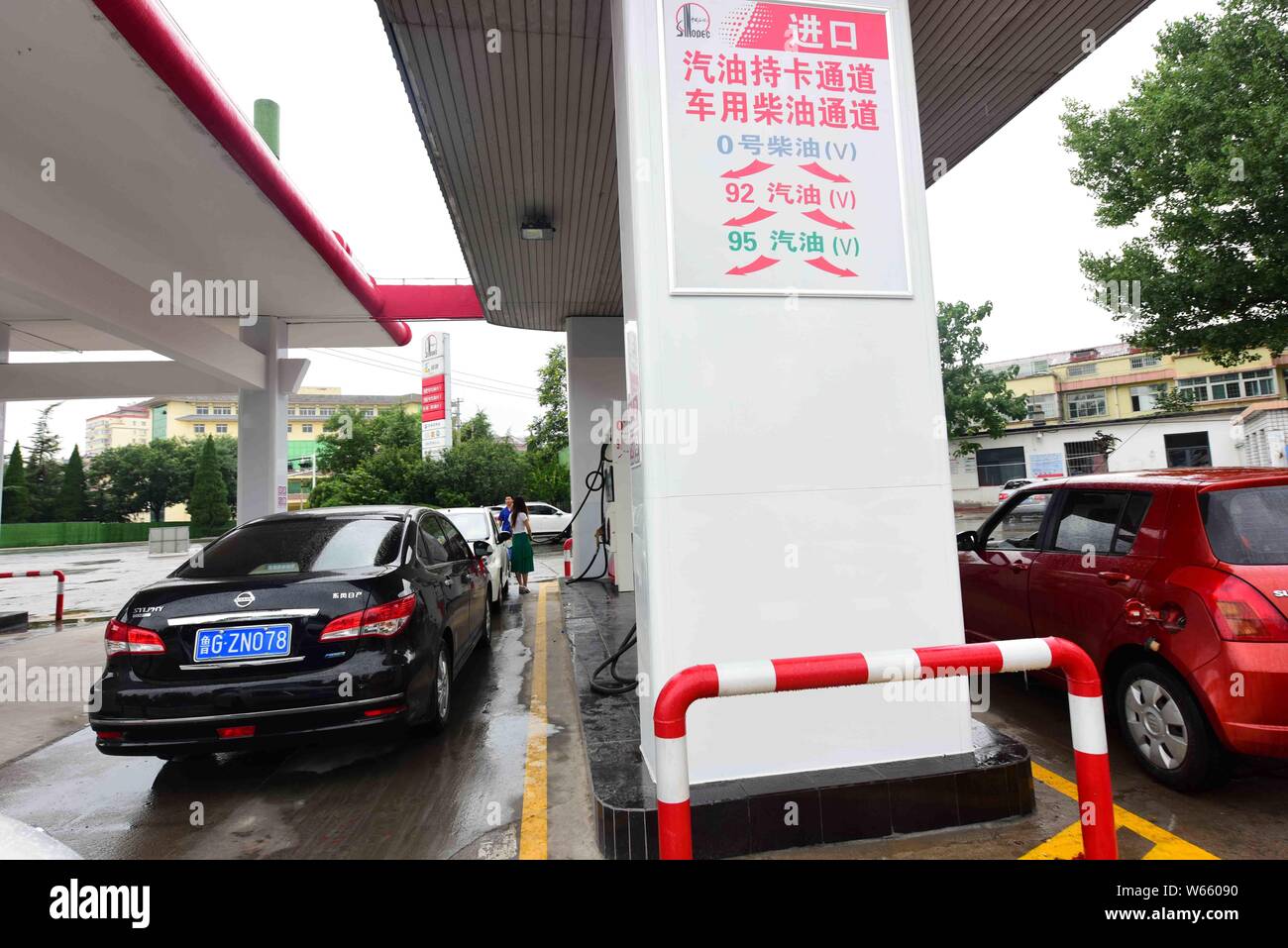 --FILE--Vehicles are being refueled at a gas station of China Petroleum ...
