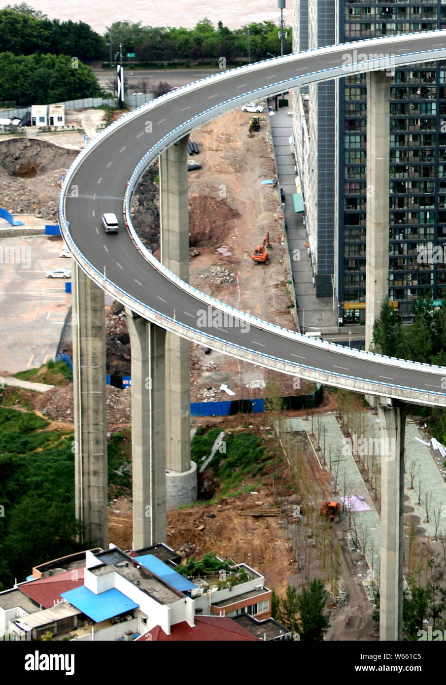 Cars drive on China's tallest highway interchange, Sujiaba Interchange ...