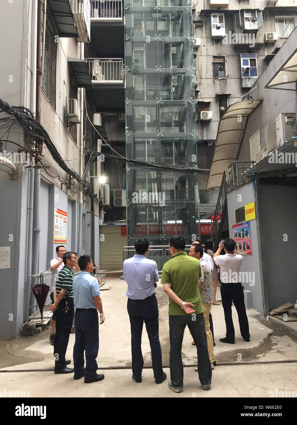 View of the sightseeing elevator built by 136 households on the facade ...