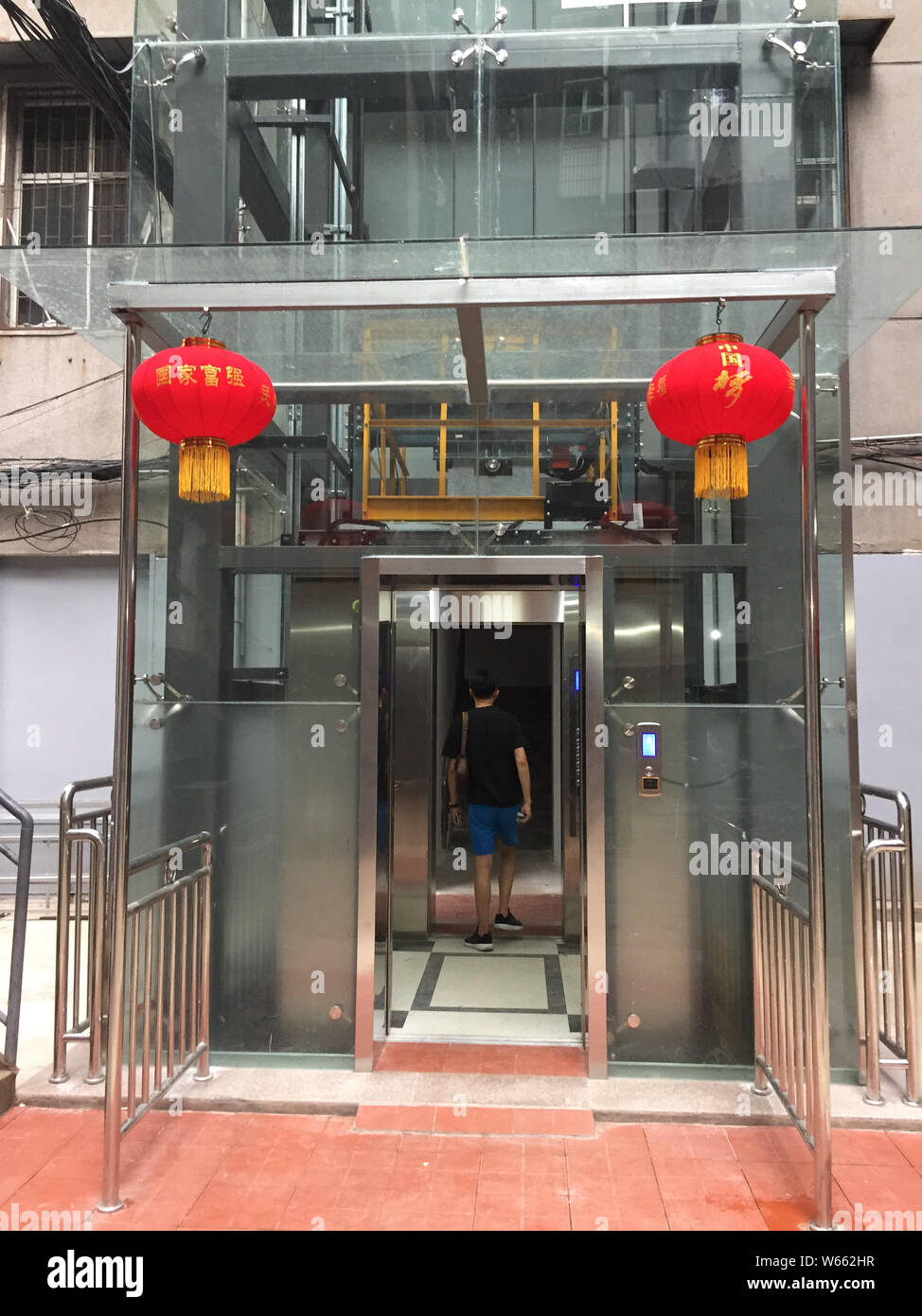 View of the sightseeing elevator built by 136 households on the facade ...