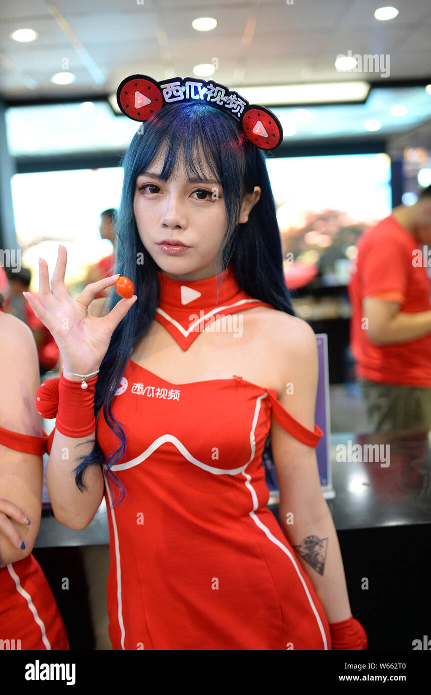 A Chinese Showgirl Poses At The Stand Of Xigua Video Watermelon Video Of Chinese Internet