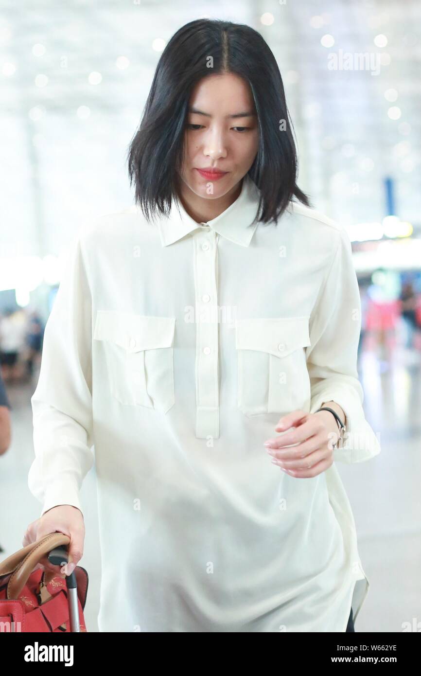 Chinese model Liu Wen arrives at the Beijing Capital International ...