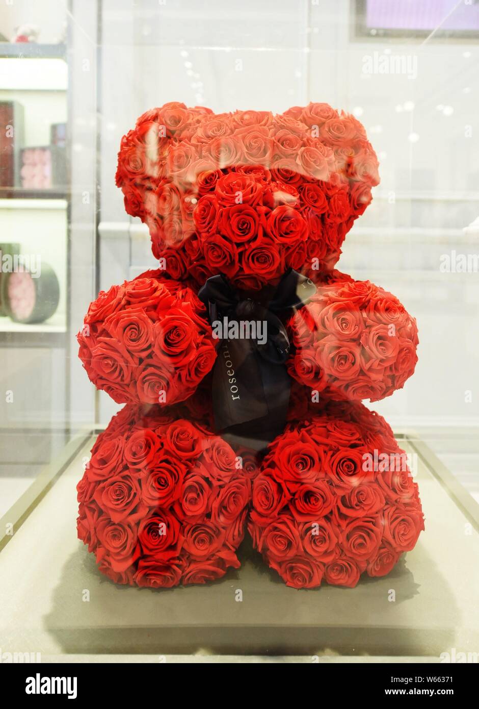 Winnie the Pooh made of 400 red roses is on display at a shopping mall ...