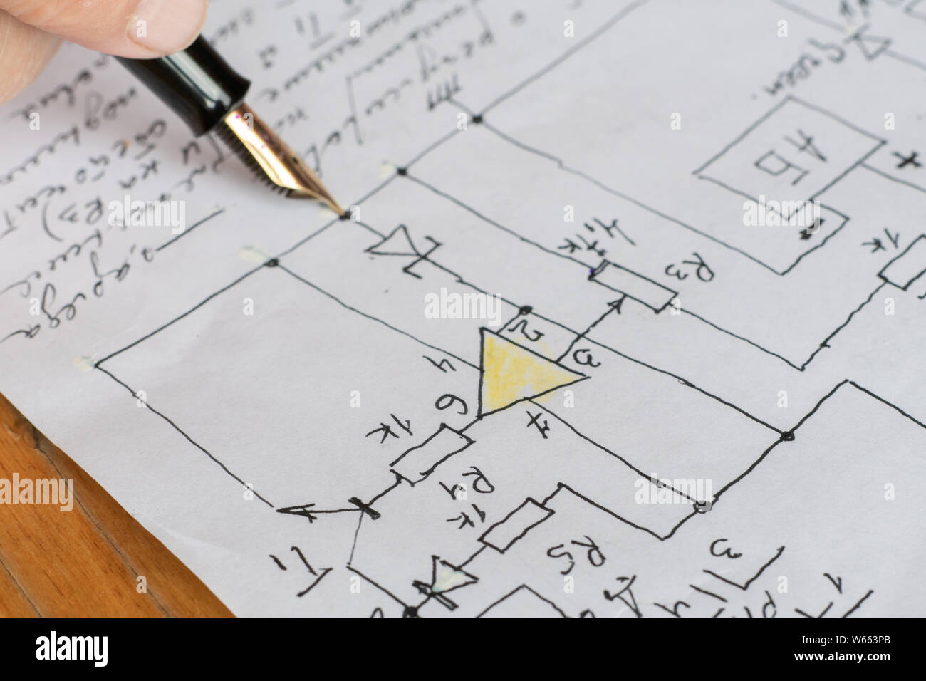 macro view of engineer planing the electrical circuit on paper Stock ...