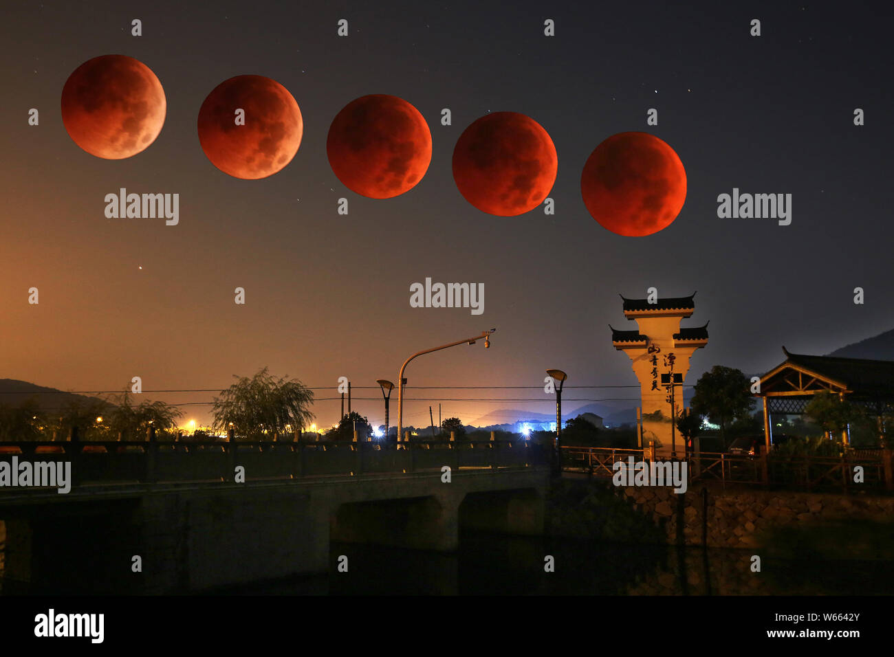 The composite photos shows the whole period of the longest "blood moon ...