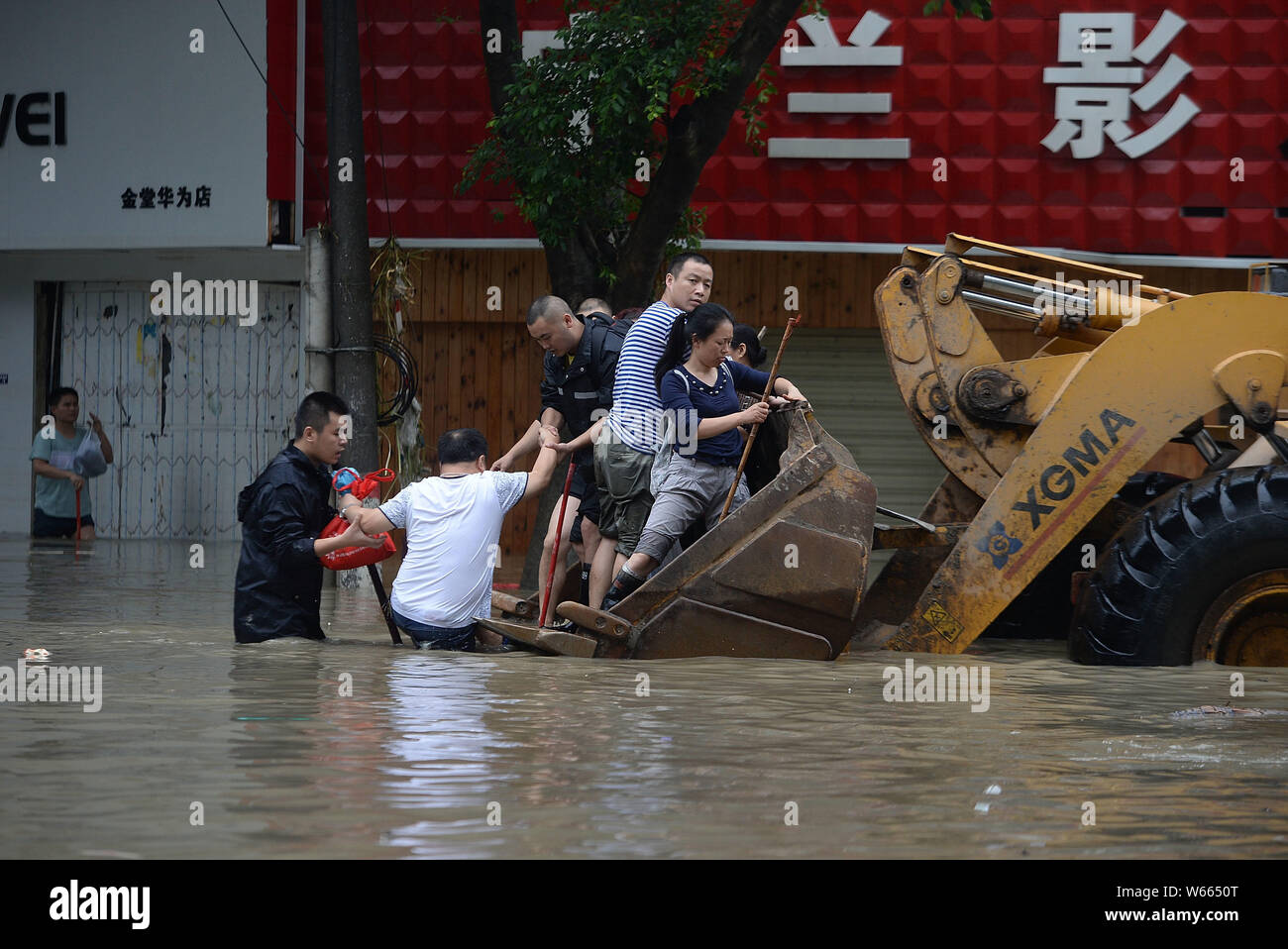 Chinese rescuers evacuate local residents in floodwater caused by heavy ...