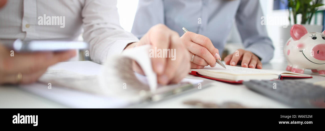 Young family man and woman checking Stock Photo - Alamy