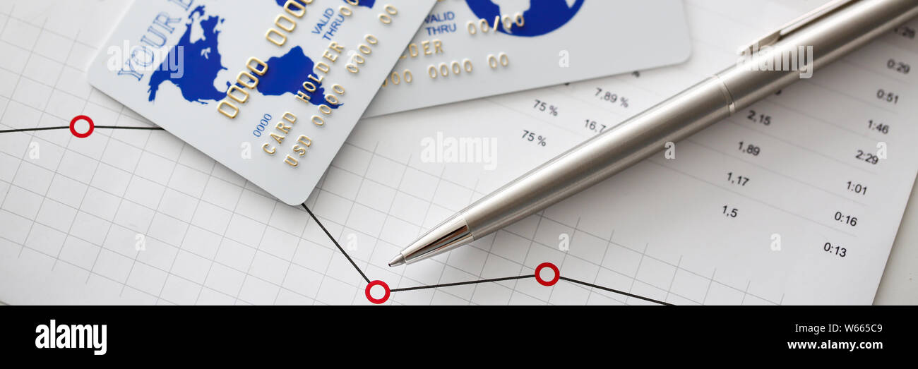 Bank cards are on charts with financial statistics Stock Photo - Alamy