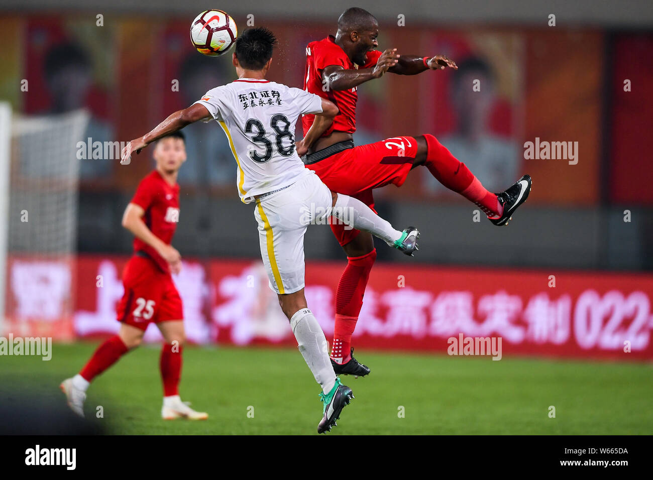 French football player Anthony Modeste, right, of Tianjin Quanjian ...