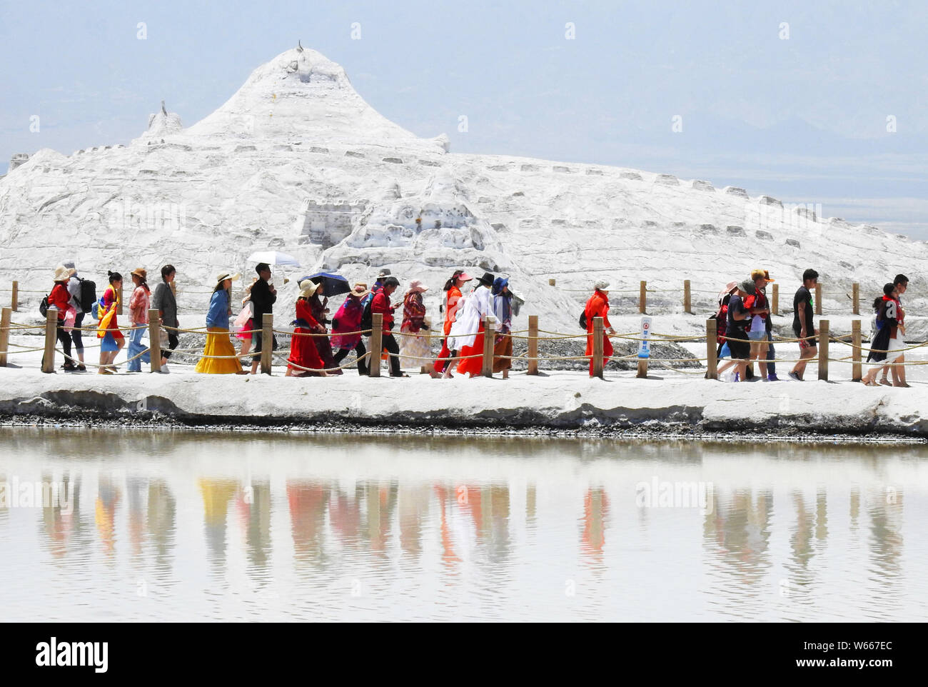Tourists visit the Chaka Salt Lake in Ulan county, Haixi Mongol and ...
