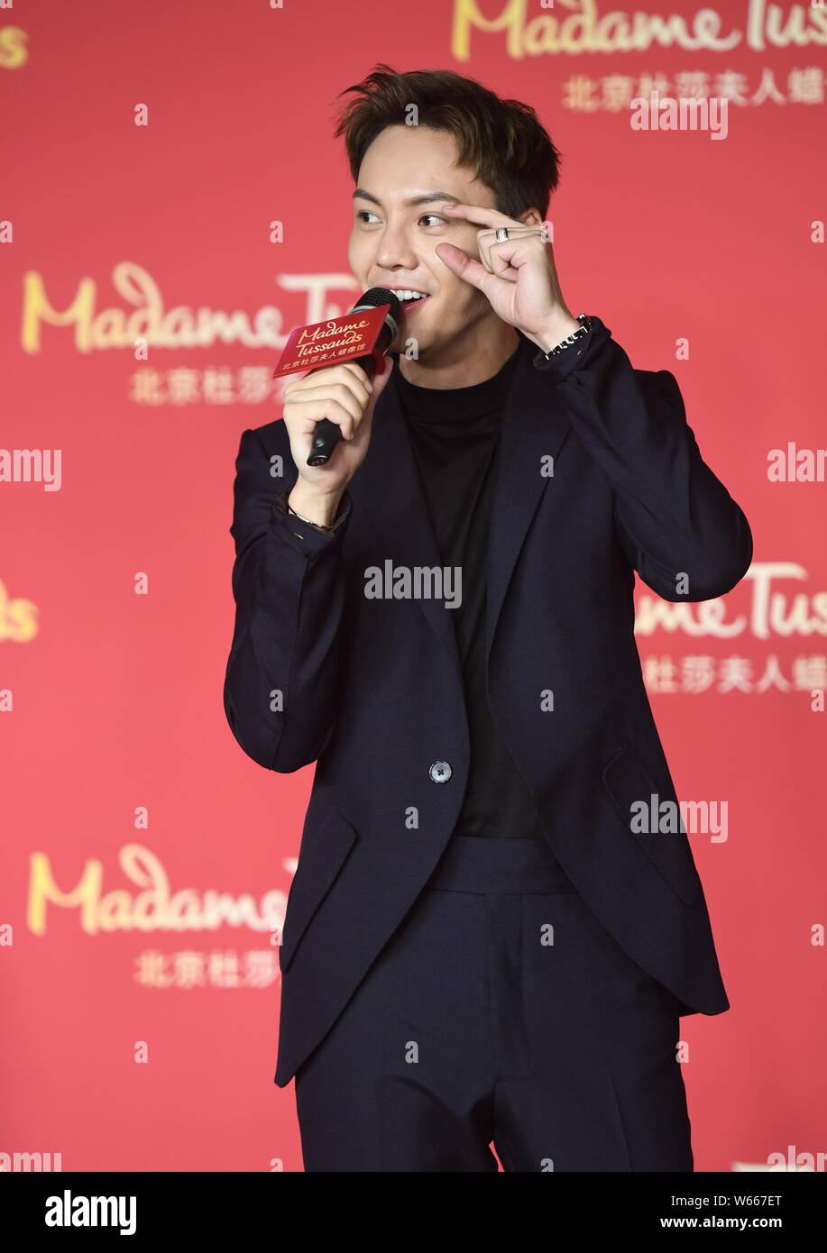 Hong Kong singer and actor William Chan poses during an unveiling ...