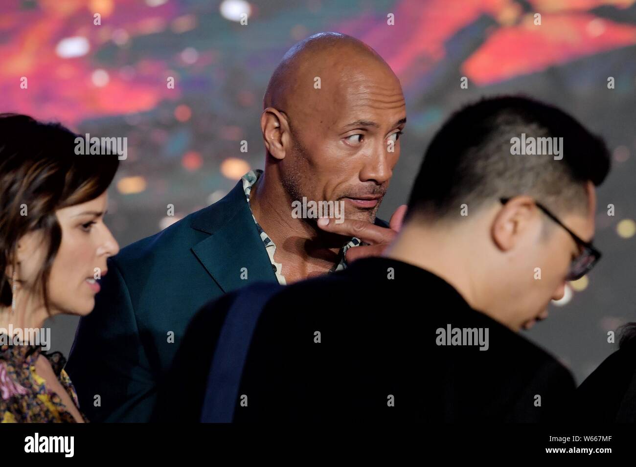 American actor Dwayne Johnson. center, and Canadian actress Neve ...