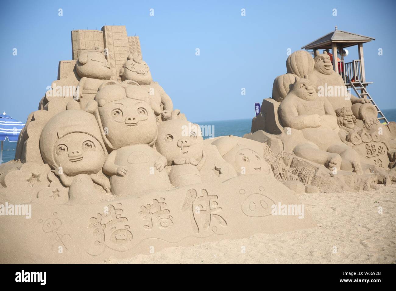 A sand sculpture of characters from the Chinese animated television ...