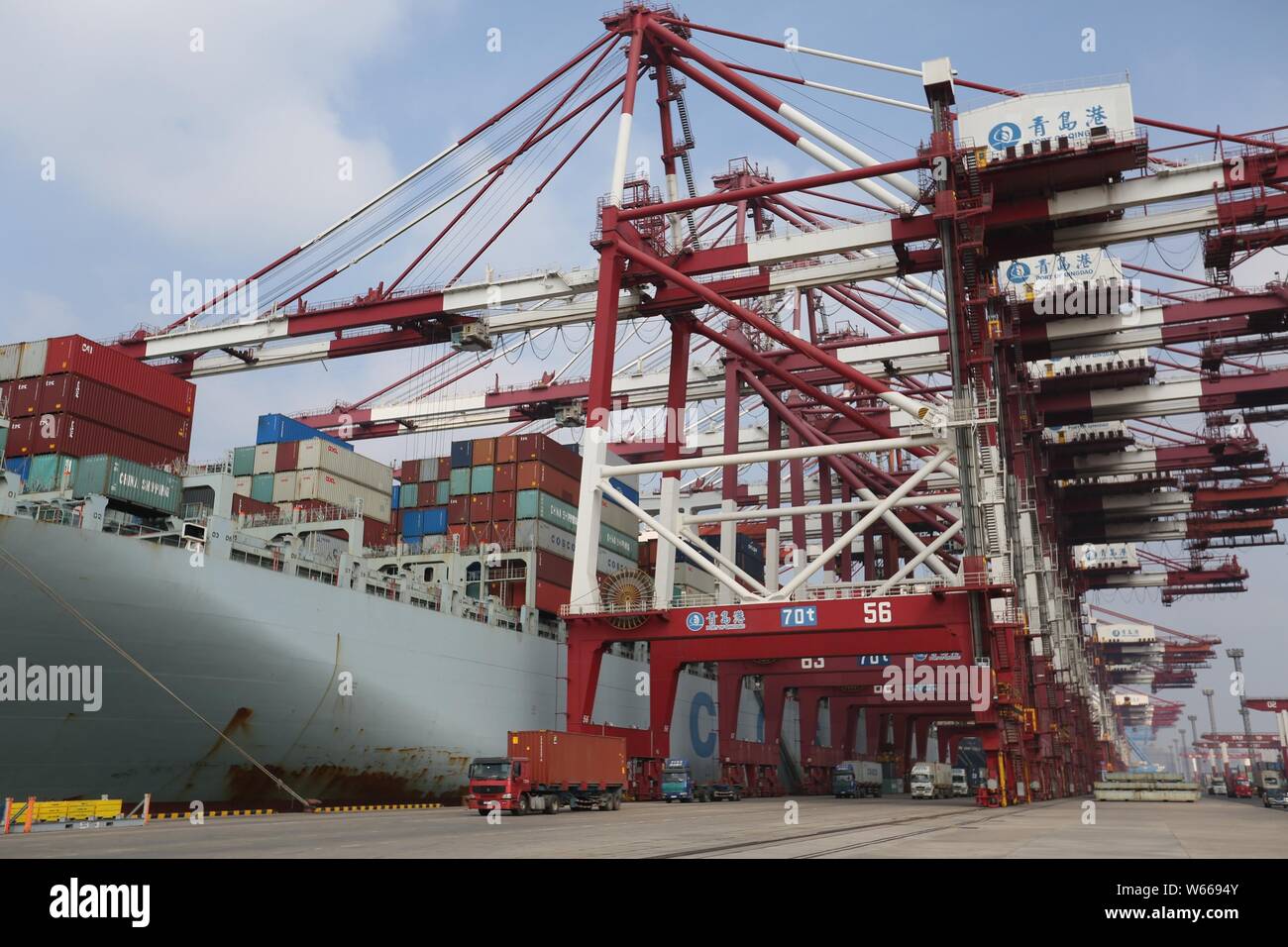 --FILE--A cargo ship loaded with containers to be shipped abroad berths ...