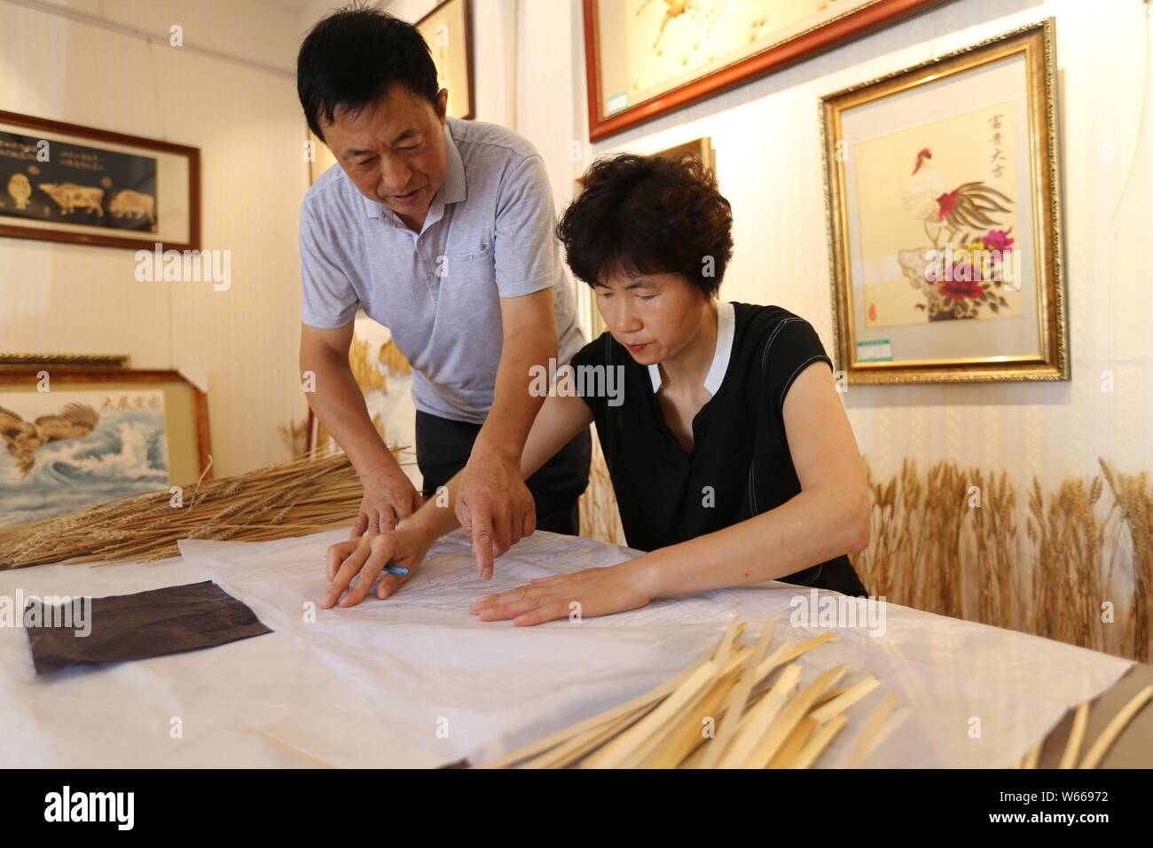 A local resident creates a wheat straw painting with the help of ...