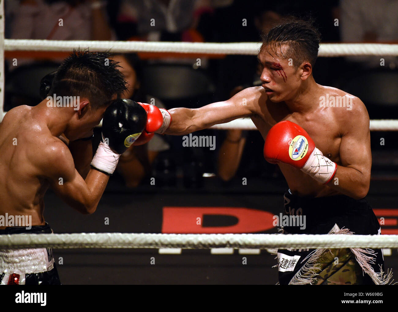 Raymond Poon Kai-ching of Hong Kong, left, competes against Ryo ...