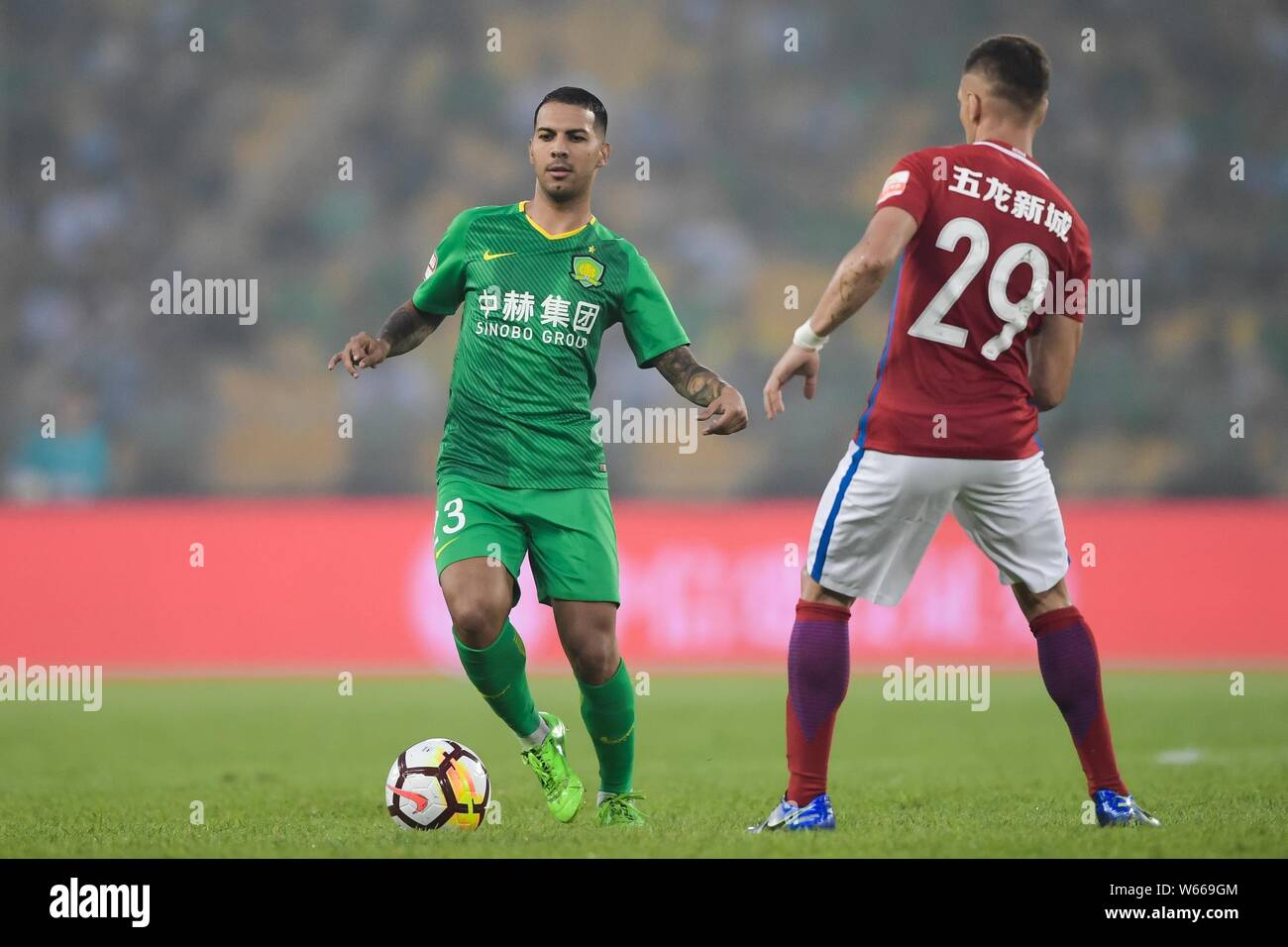 Spanish football player Jonathan Viera, left, of Beijing Sinobo Guoan ...