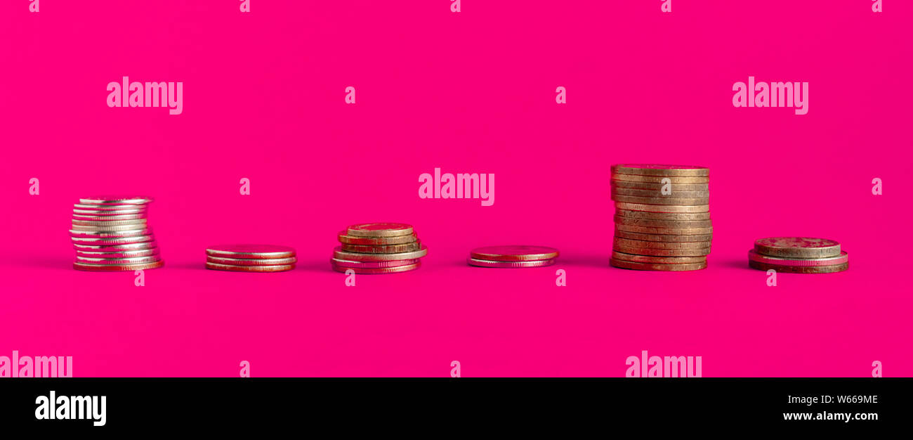 stack of cash coins showing increase graph on color surface Stock Photo ...