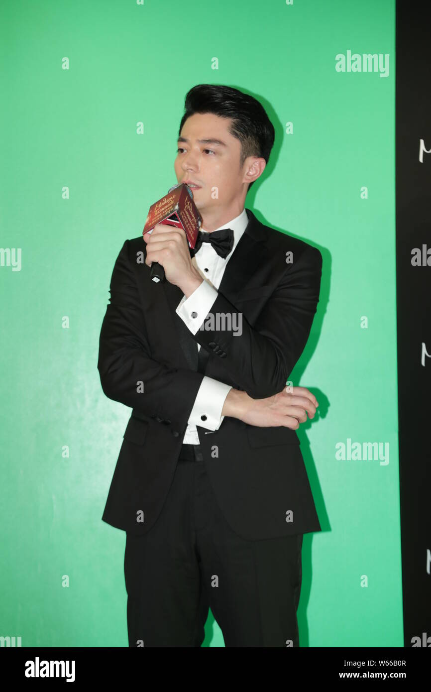 Taiwanese actor Wallace Huo attends an unveiling ceremony for a wax ...