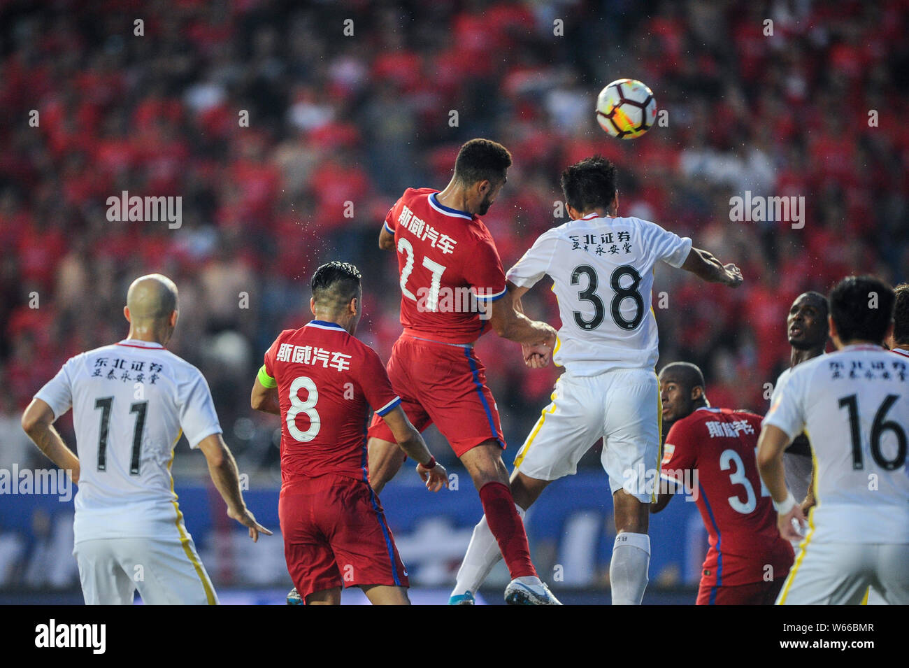 Brazilian football player Alan Kardec of Chongqing SWM, left, heads the ...