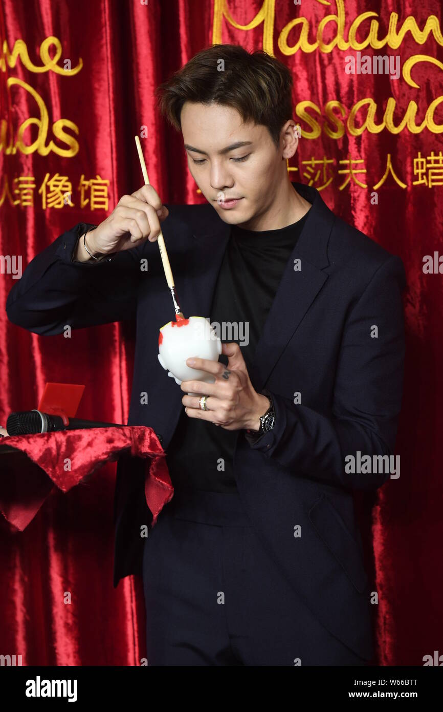 Hong Kong singer and actor William Chan poses during an unveiling ...