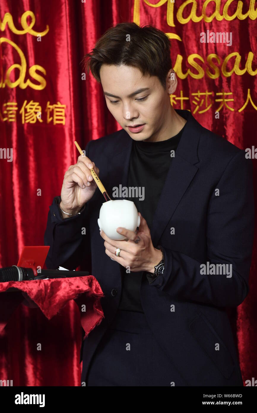 Hong Kong singer and actor William Chan poses during an unveiling ...