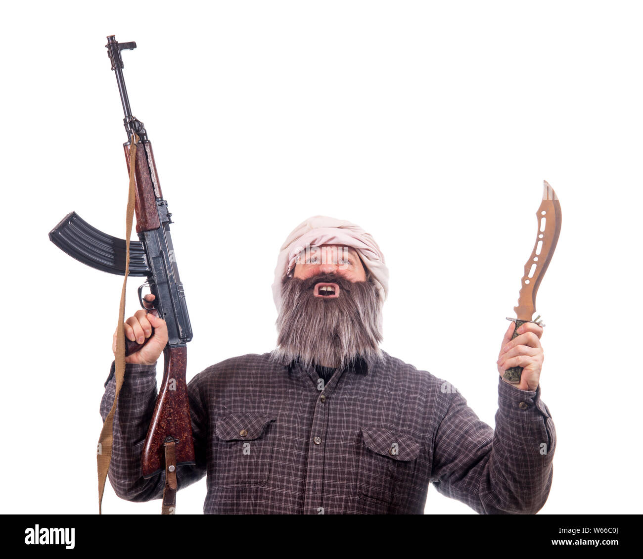 The bearded man armed with kalashnikov and knife isolated on a white ...