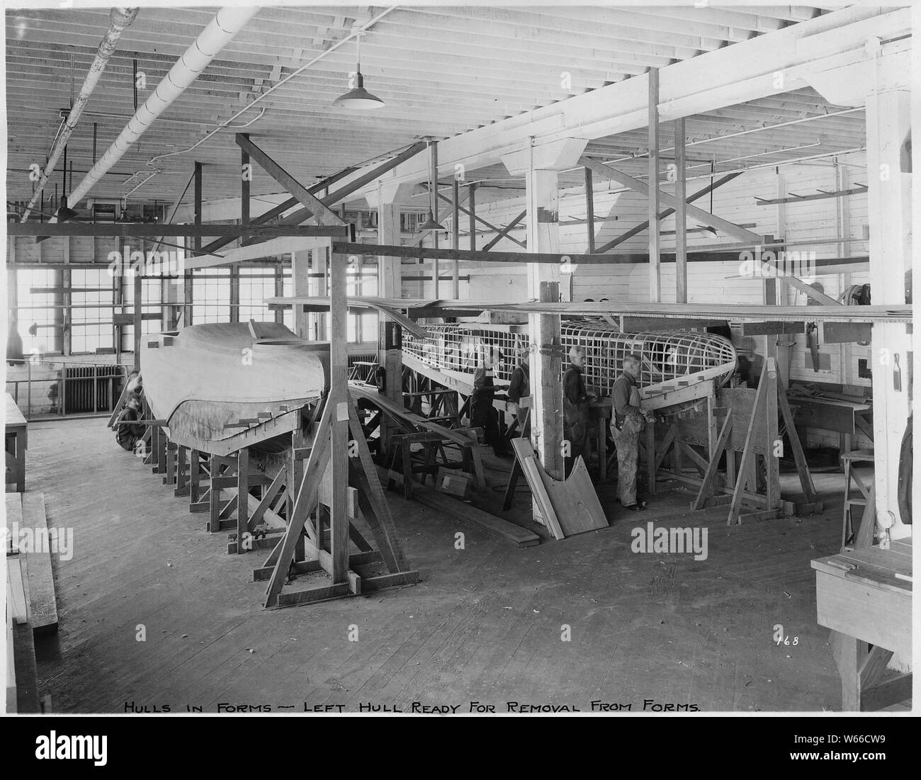 Hulls in forms -- left hull redy for removal from forms; Scope and ...