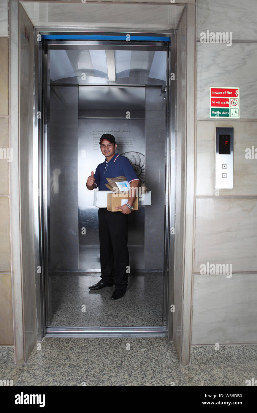 Holding the elevator door hi-res stock photography and images - Alamy