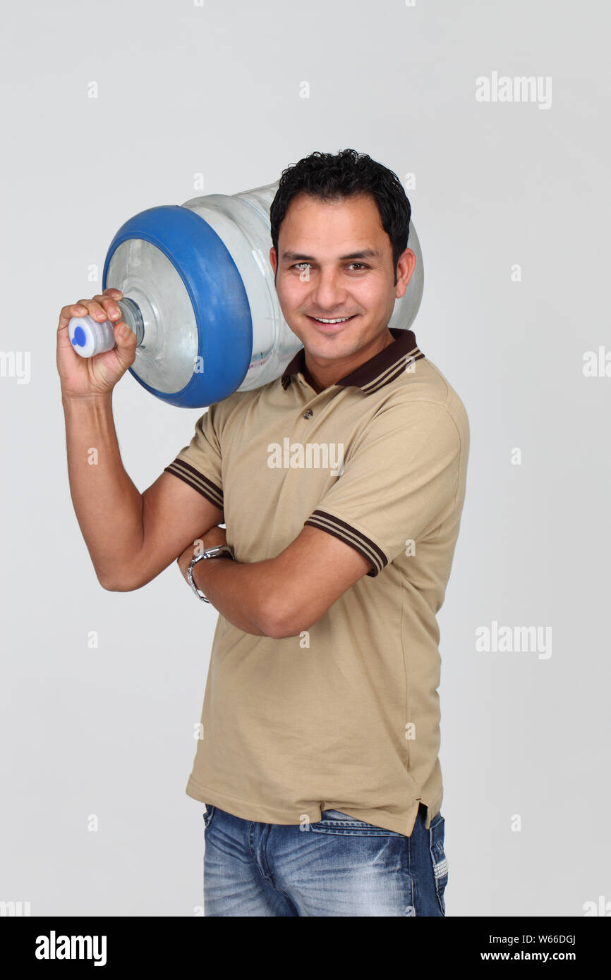 Indian Boy Carrying Water Bottle High Resolution Stock Photography and ...