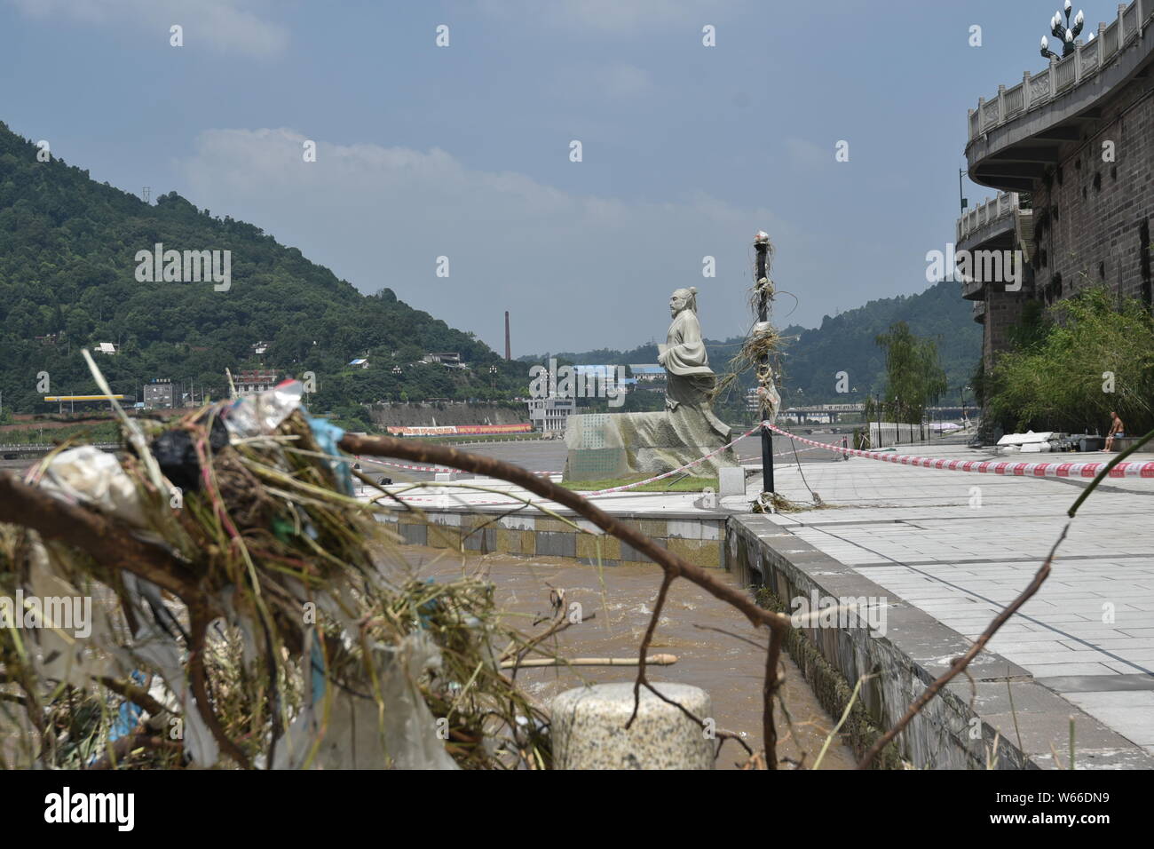 View of the standing statue of Huang Tingjian and the damaged statue of ...