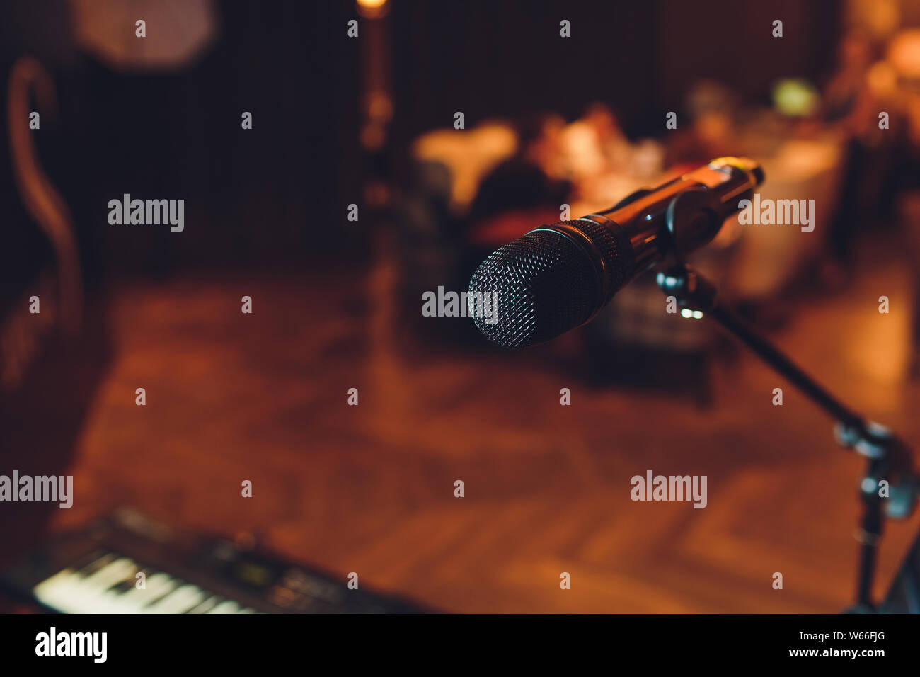 Microphone on stage against a background of auditorium Stock Photo - Alamy