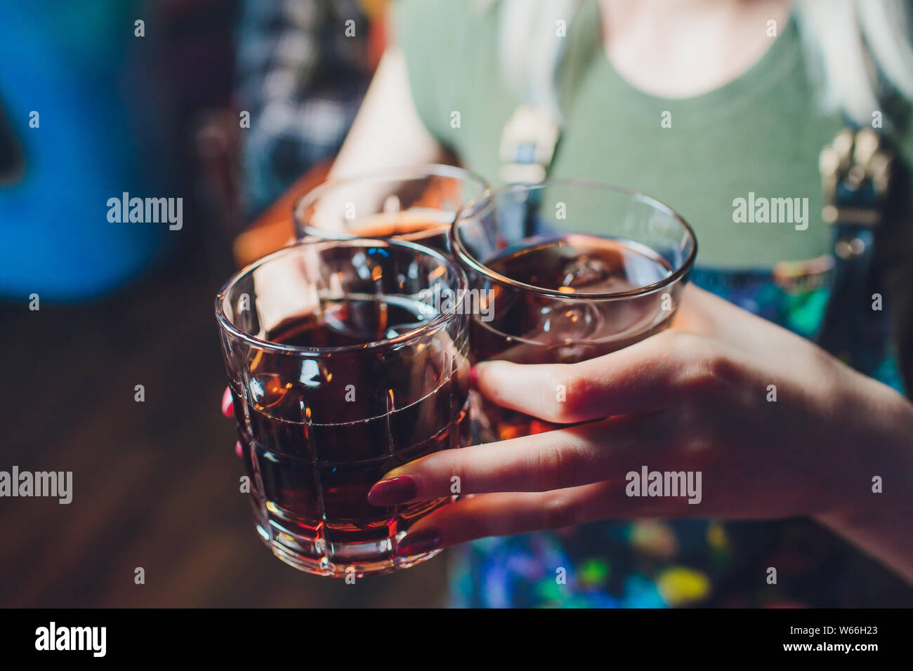 Male Hands Cheer With Glasses Of Shot Or Liqueur Friends Drink Shot Or Liqueur And Cheers Male