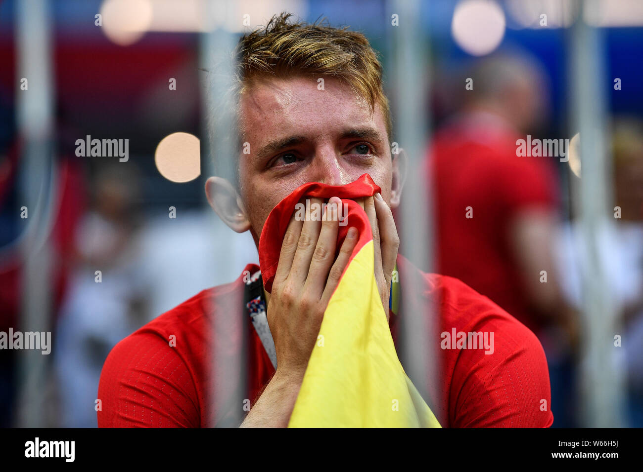 A Spanish fan weeps at the Luzhniki Stadium after Spain was defeated by ...